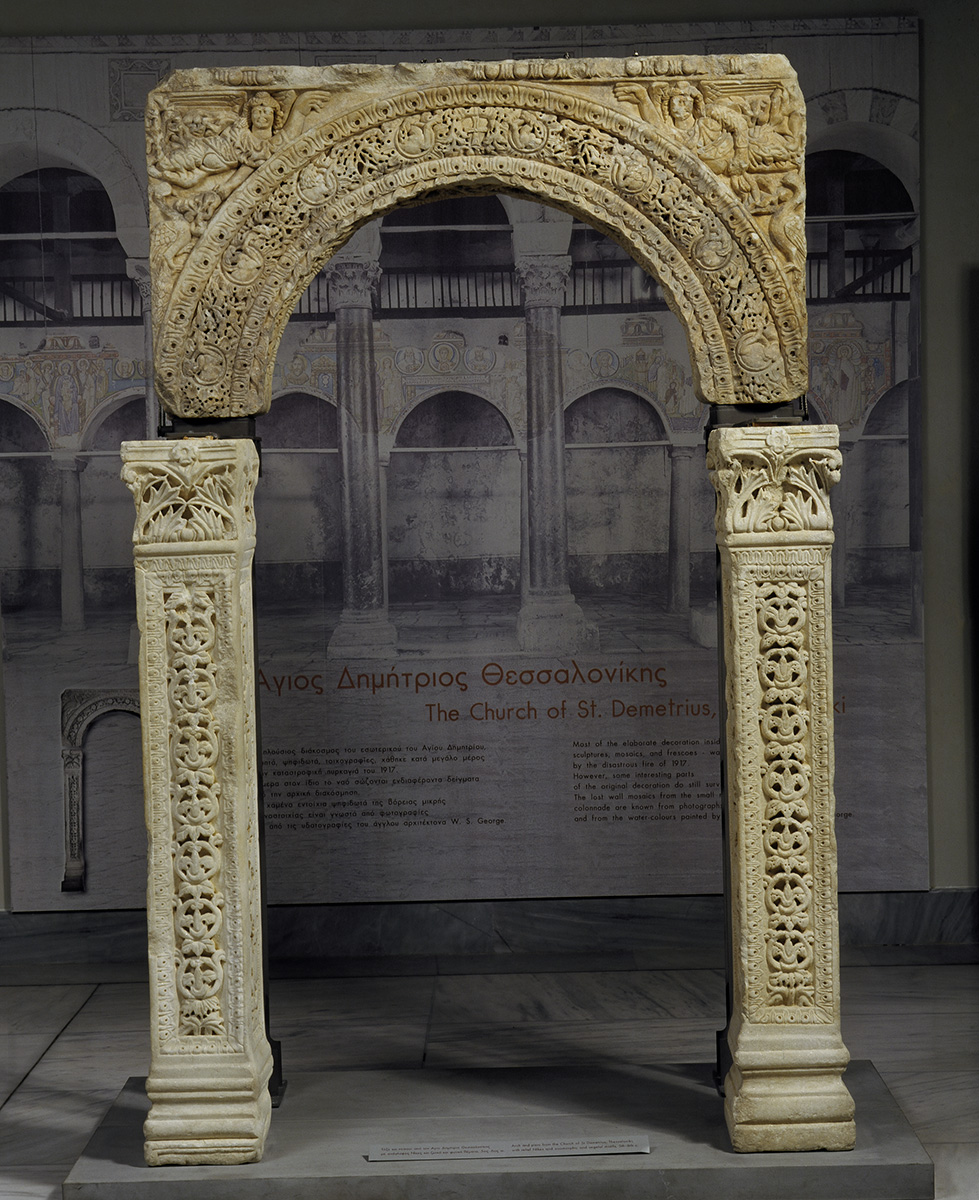 Relief arch with peacocks and angles, supported by two pillars with ...